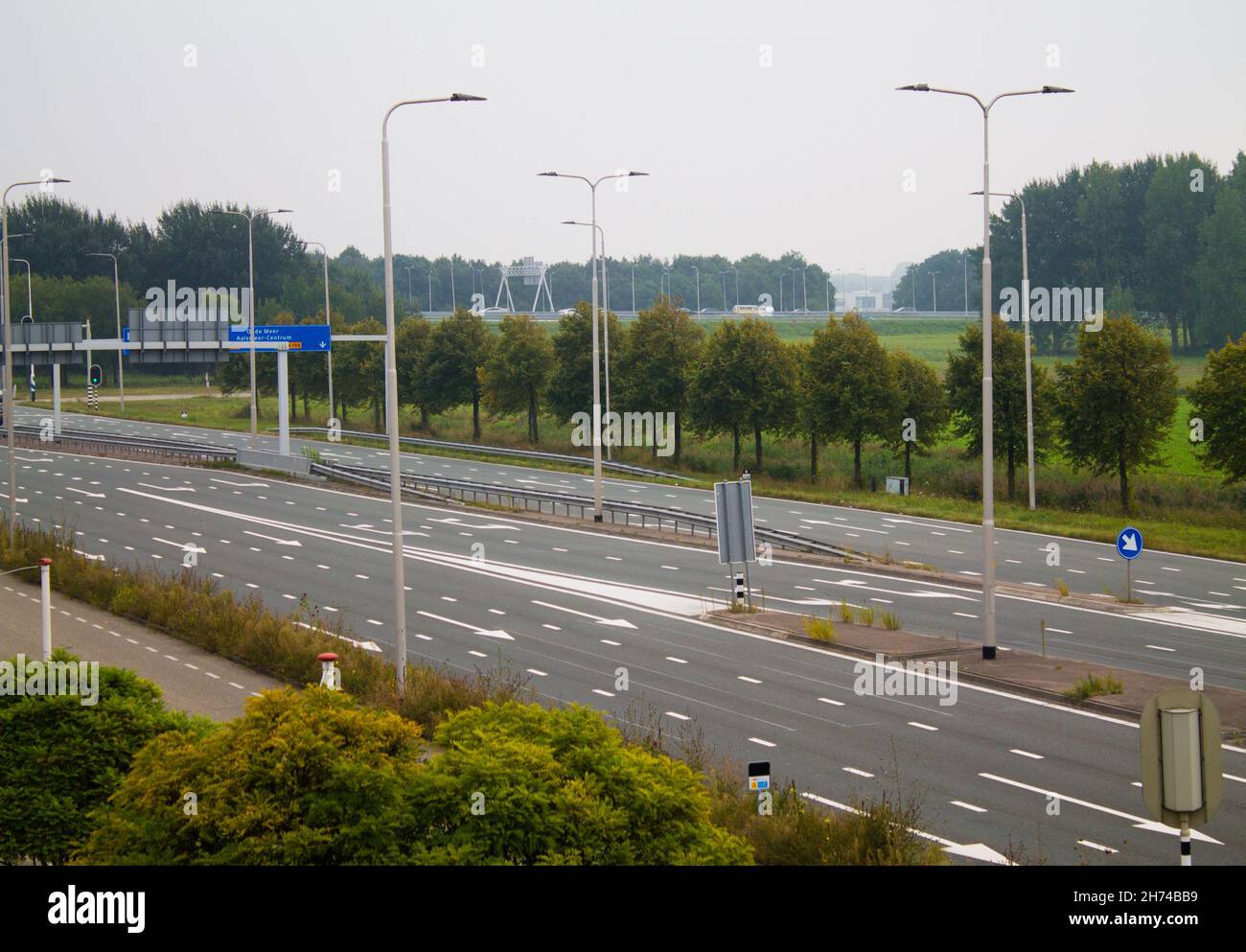 Landscape view of an expressway surrounded by trees Stock Photo - Alamy