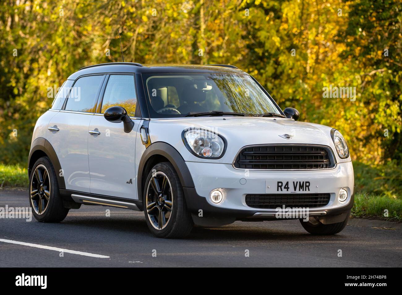 White mini car or vehicle driving travelling hi-res stock photography ...