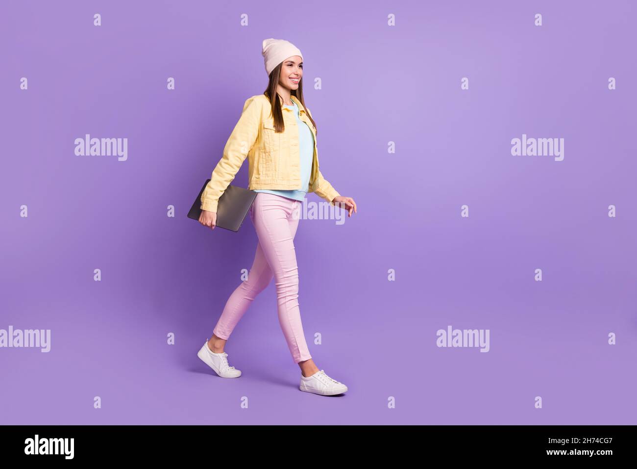 Full length body size photo of female programmer with laptop going ...