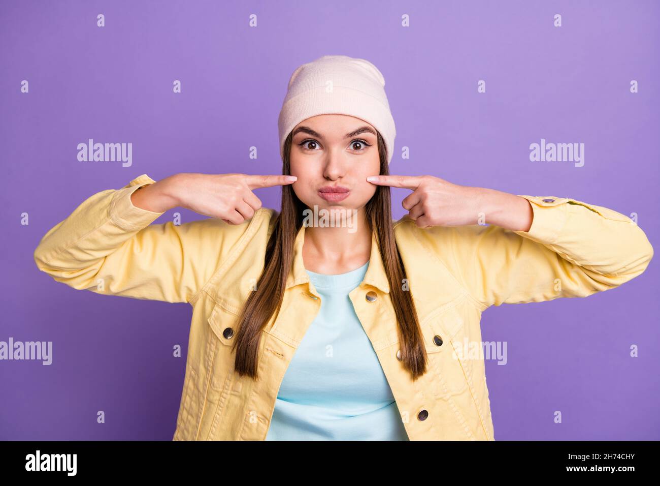 Portrait of optimistic straight hairdo girl puff cheeks wear cap jacket ...