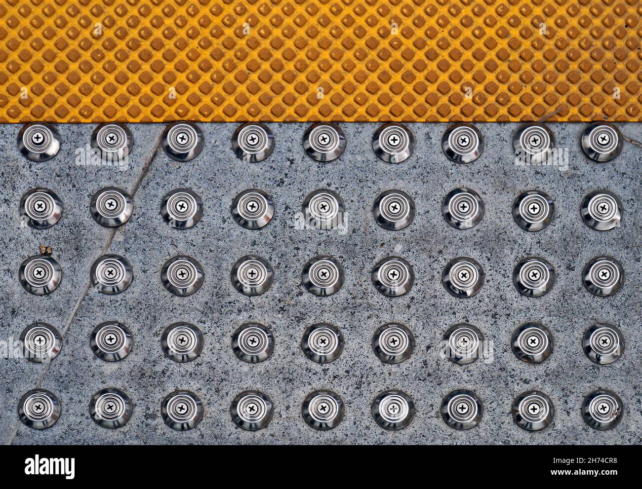 Warning bumps for blind people on sidewalk Stock Photo - Alamy