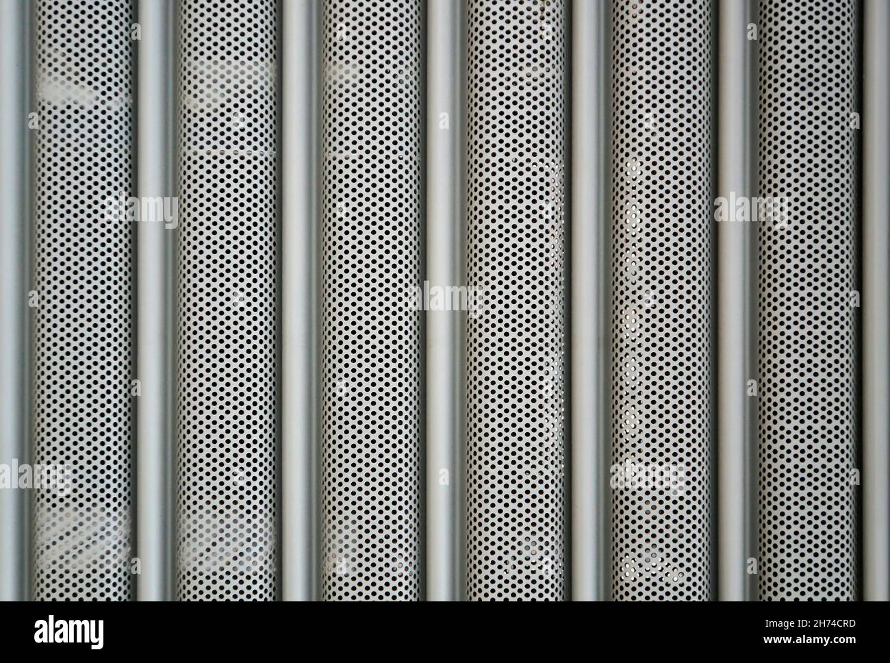 Perforated metallic surface texture background Stock Photo - Alamy