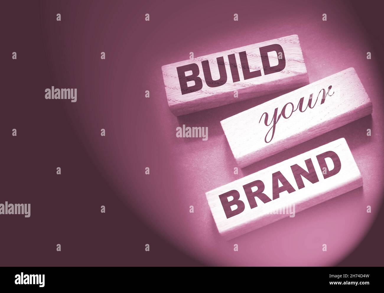 Phrase BUILD YOUR BRAND written on wooden blocks. With vintage styled ...