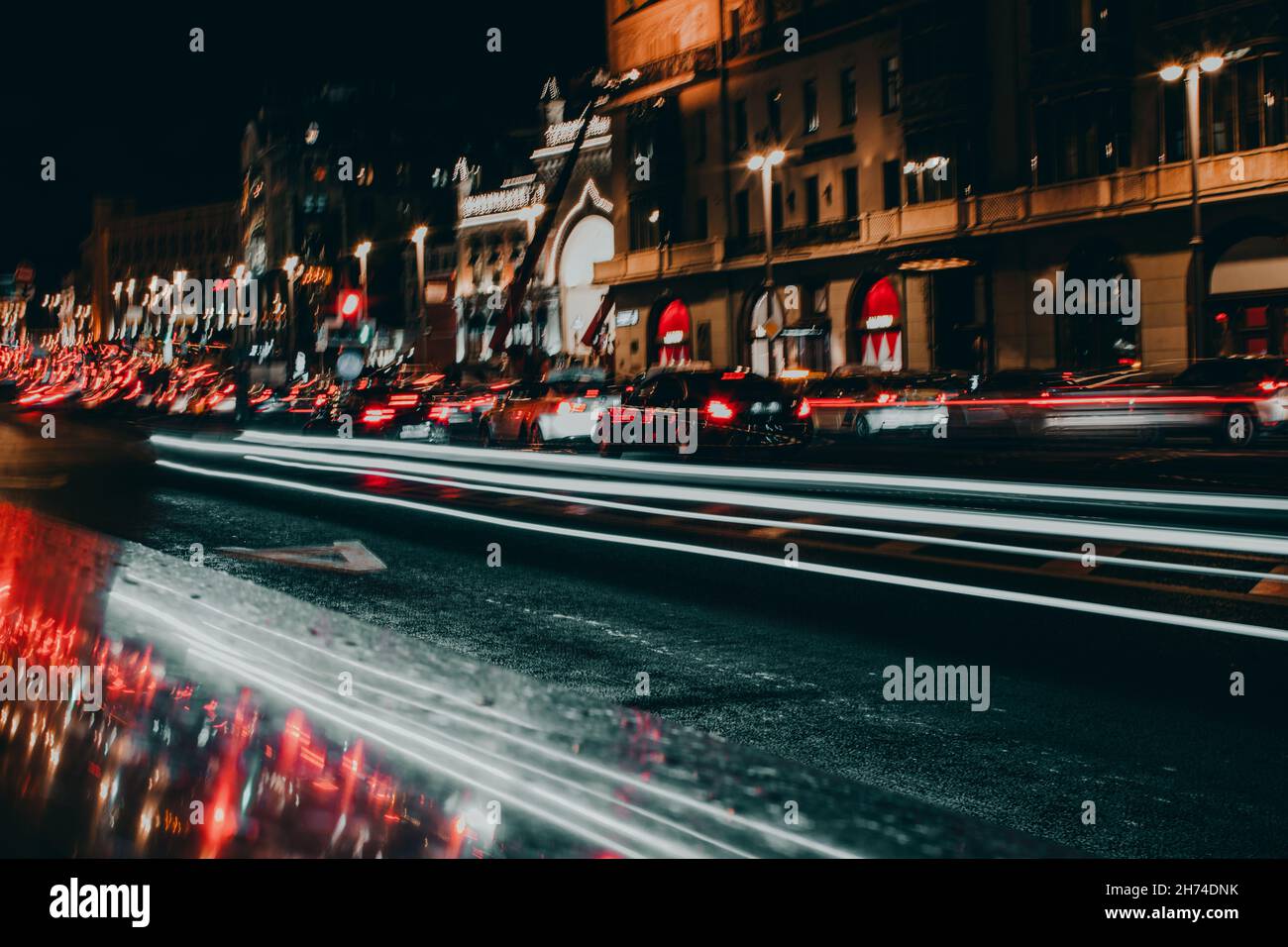 Blurry bokeh lights of moving cars in the light of the night city Stock ...