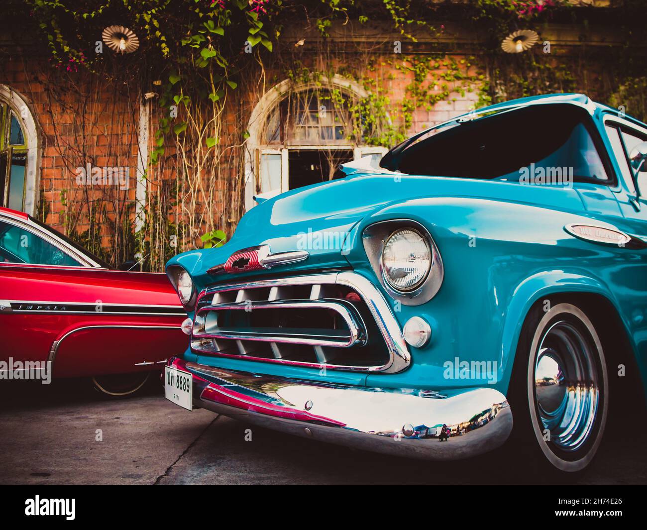 Blue vintage classic car in a colorful street of old town. Travel and ...
