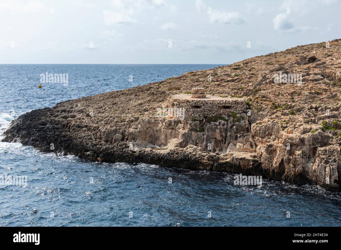 A well camouflaged Second World War machine gun post at Wied iz-Zurrieq ...