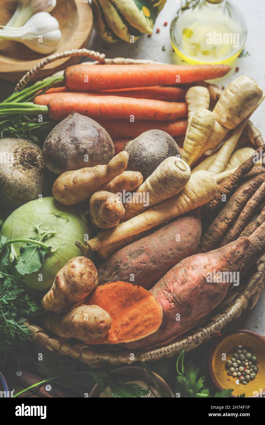 Close up of various raw organic root vegetables: Parsnip, sweet potato ...