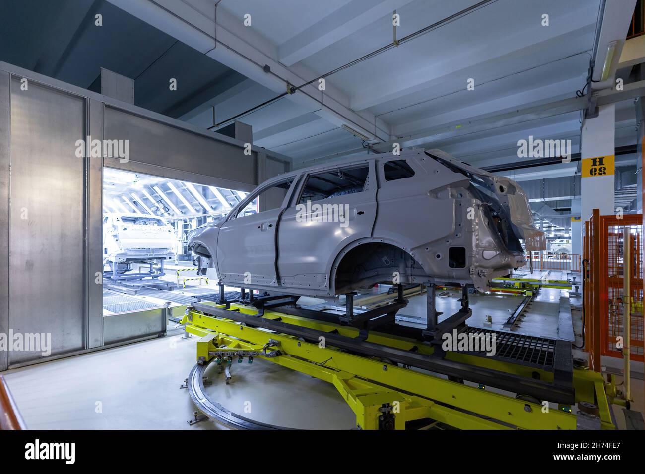 Car body is on assembly line. Factory for production of cars. Modern ...