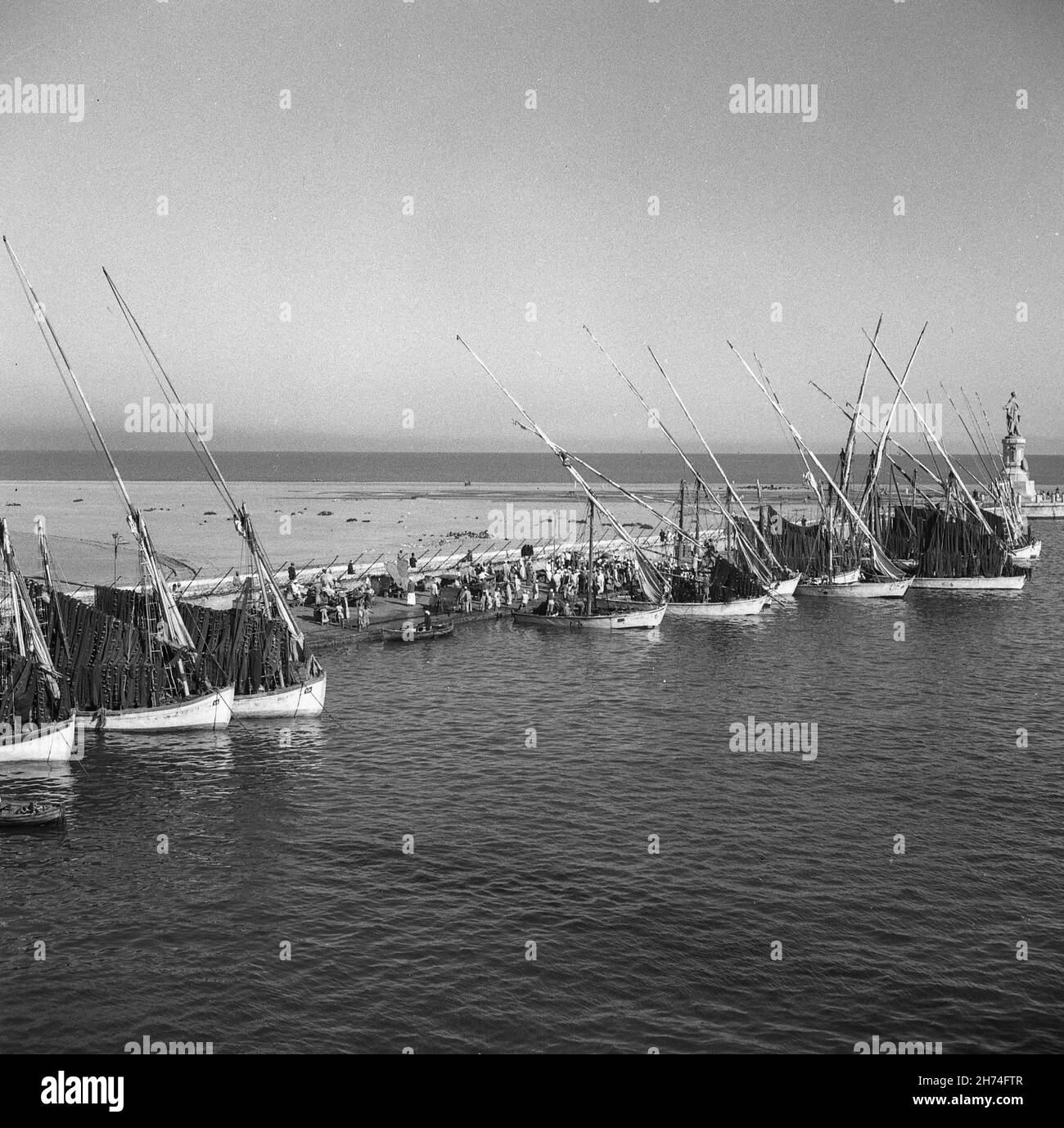 Sail boat docked in Black and White Stock Photos & Images - Alamy