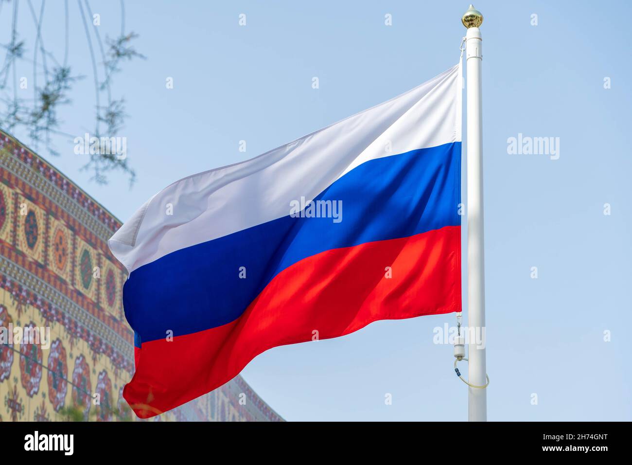 Russia flag white, blue and red blowing in the wind with blue sky ...