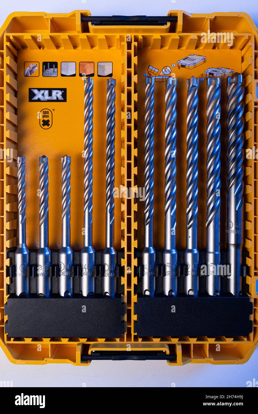 Vertical Close-up photo of yellow and transparent kit box with drills ...