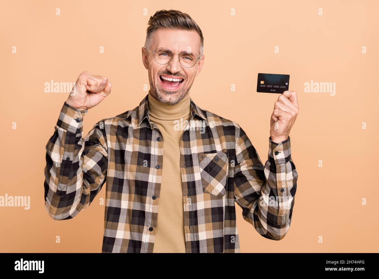 Photo of mature cheerful man rejoice victory ecstatic triumph earnings ...