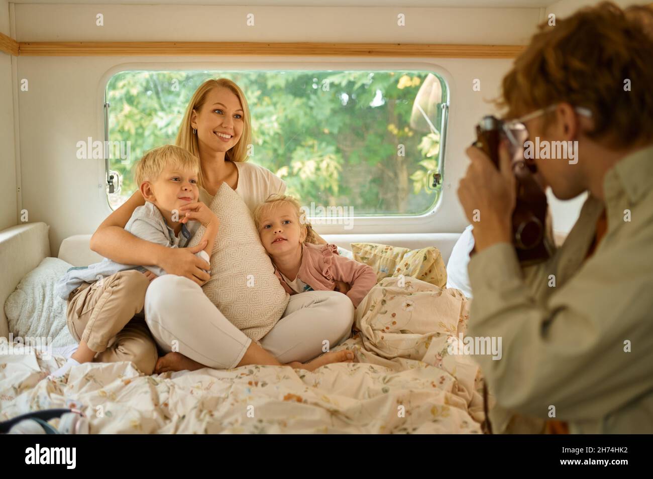 Mother with children poses in motorhome, camping Stock Photo - Alamy