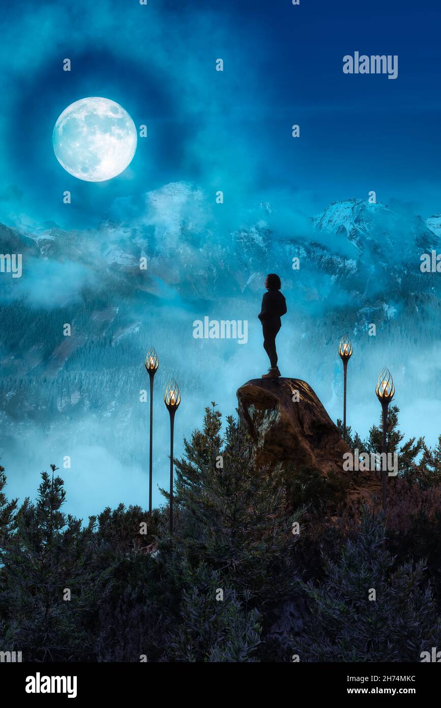 Magical night scene in nature. Mountain landscape with big moon in sky ...