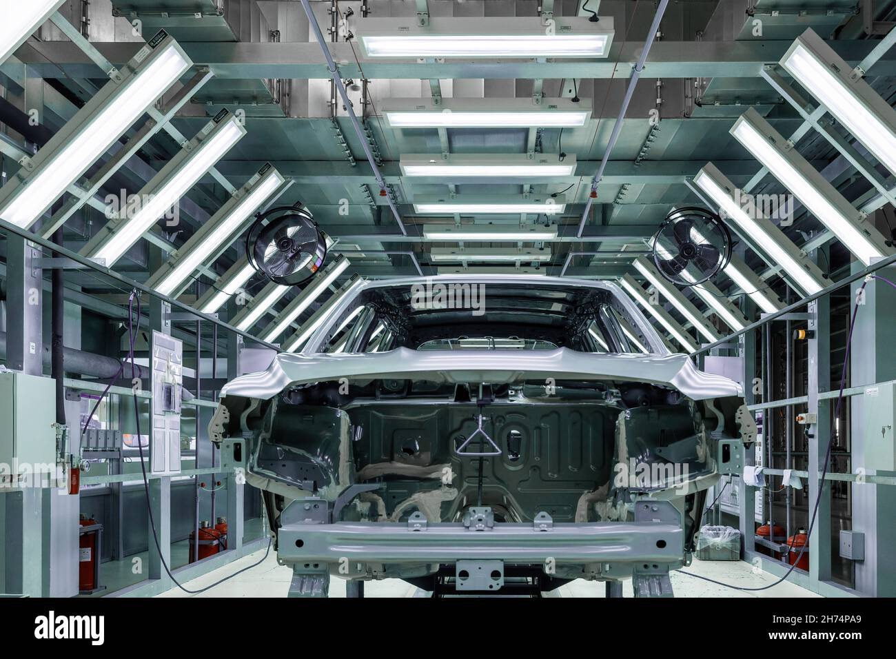 Car bodies are on assembly line. Factory for production of cars. Modern ...