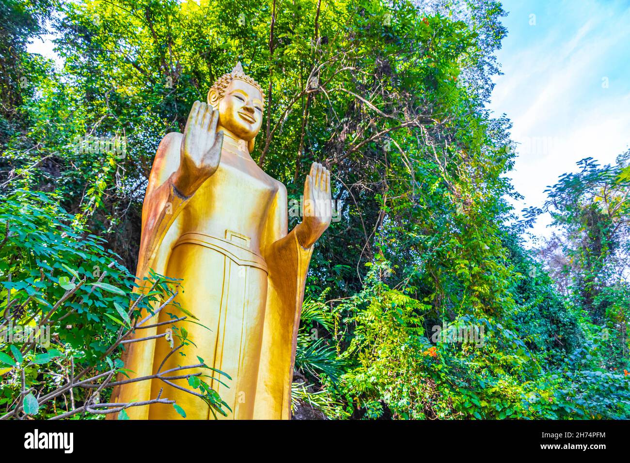 Golden buddha statues figure on the mountain Phousi Hill and Wat Chom ...