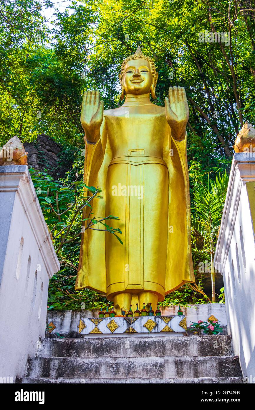 Golden buddha statues figure on the mountain Phousi Hill and Wat Chom ...