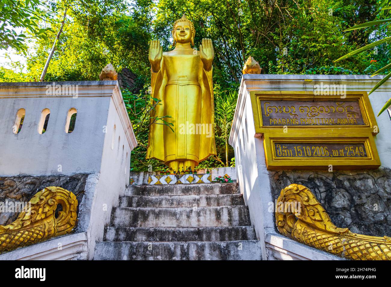 Golden buddha statues figure on the mountain Phousi Hill and Wat Chom ...