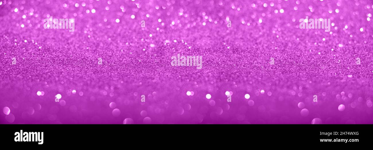 Defocused violet glittering background with shinig bokeh.Large banner ...