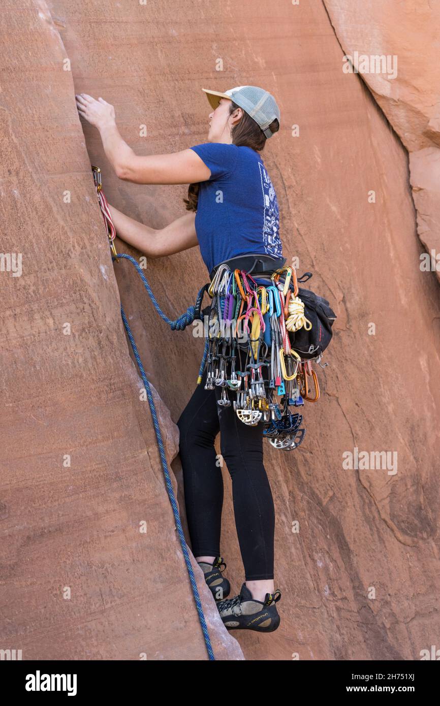 A female lead clmber climbs a crack called the Flakes of Wrath, Wall ...