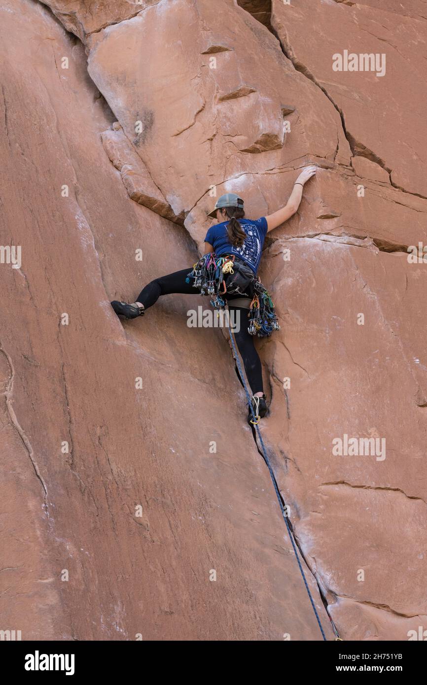 A female lead clmber climbs a crack called the Flakes of Wrath, Wall ...