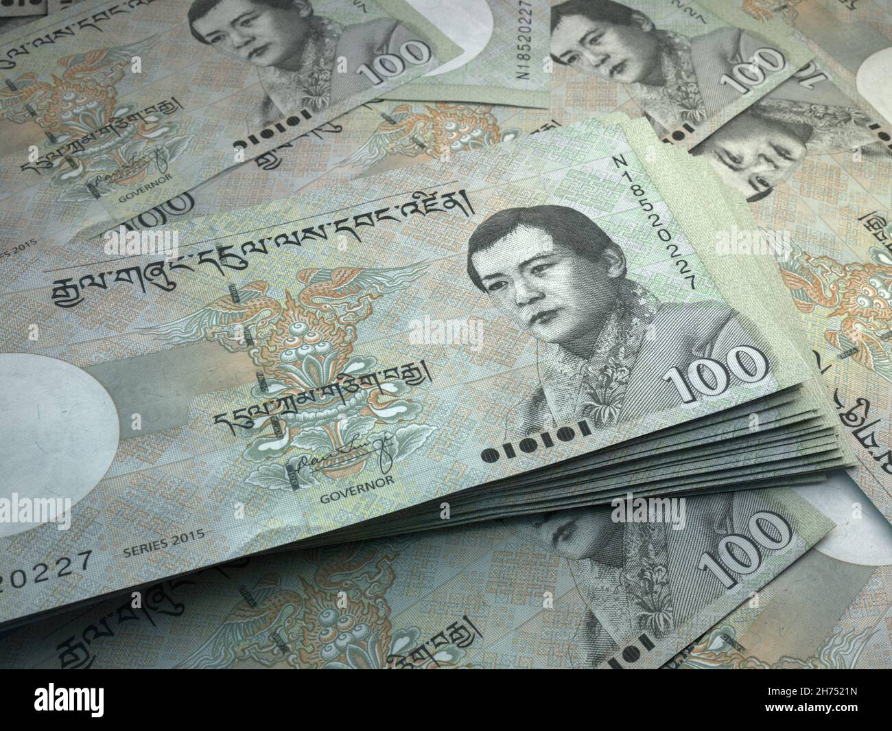 Money of Bhutan. Ngultrum bills. BTN banknotes. 100 Dzongkha. Business ...