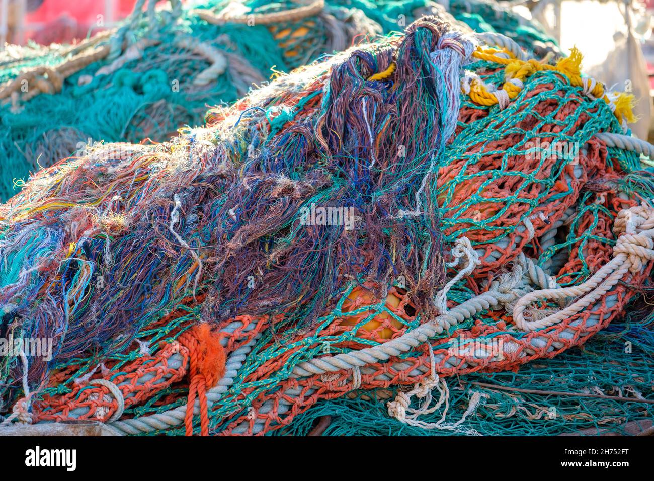 Fishing net on a fishing vessel deck. Close-up shot Stock Photo - Alamy