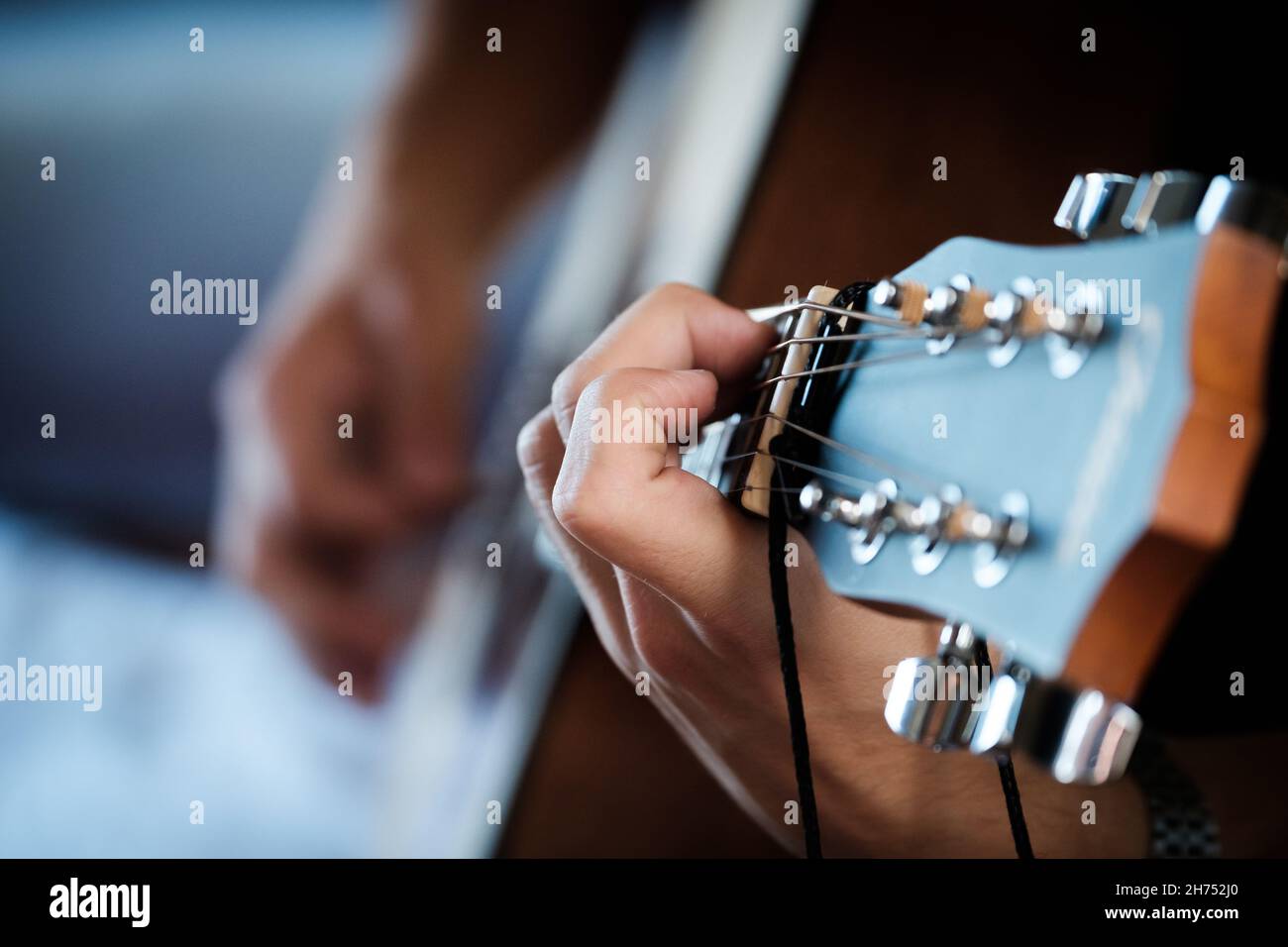 Hand playing masterly on a guitar Stock Photo - Alamy