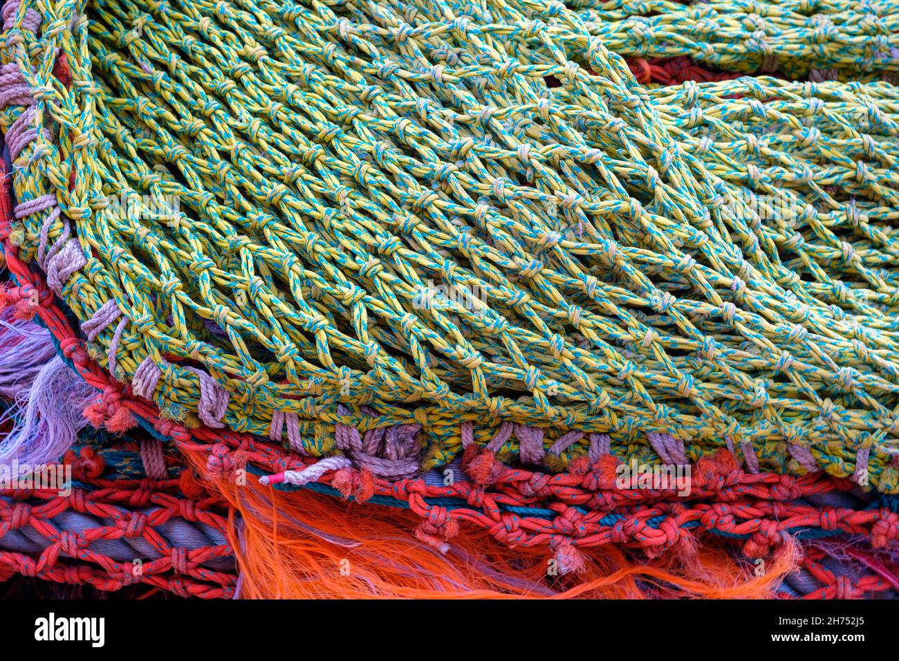 Fishing net on a fishing vessel deck. Close-up shot Stock Photo - Alamy