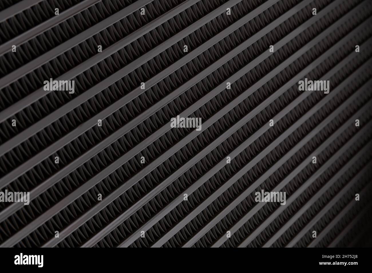 Abstract and textured Metal lines in car radiator macro close up view ...