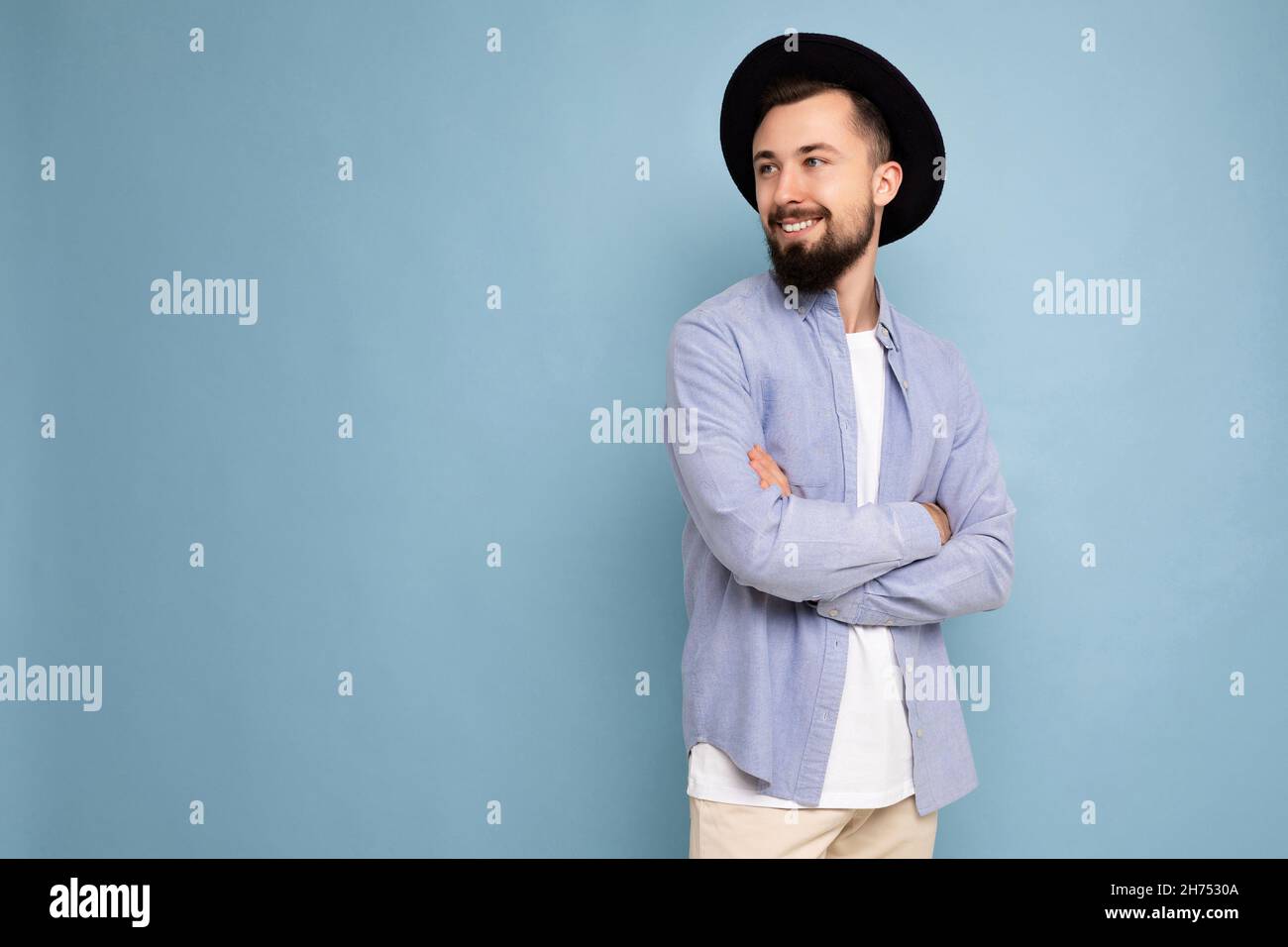 Photo shot of positive happy smiling good looking young brunet bearded ...