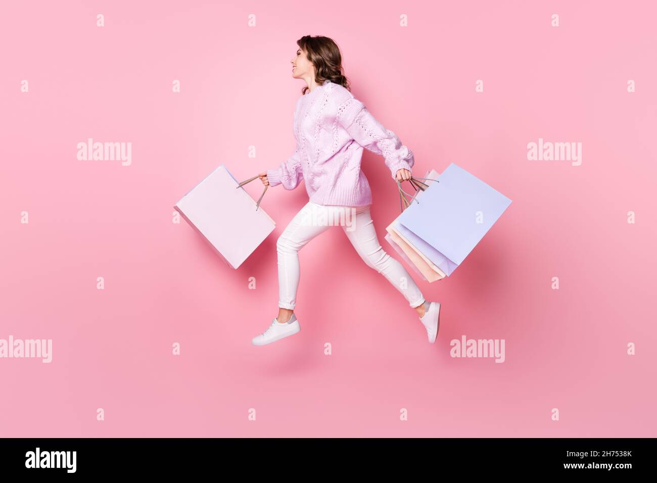 Full length body size profile side view of nice cheerful girl jumping ...