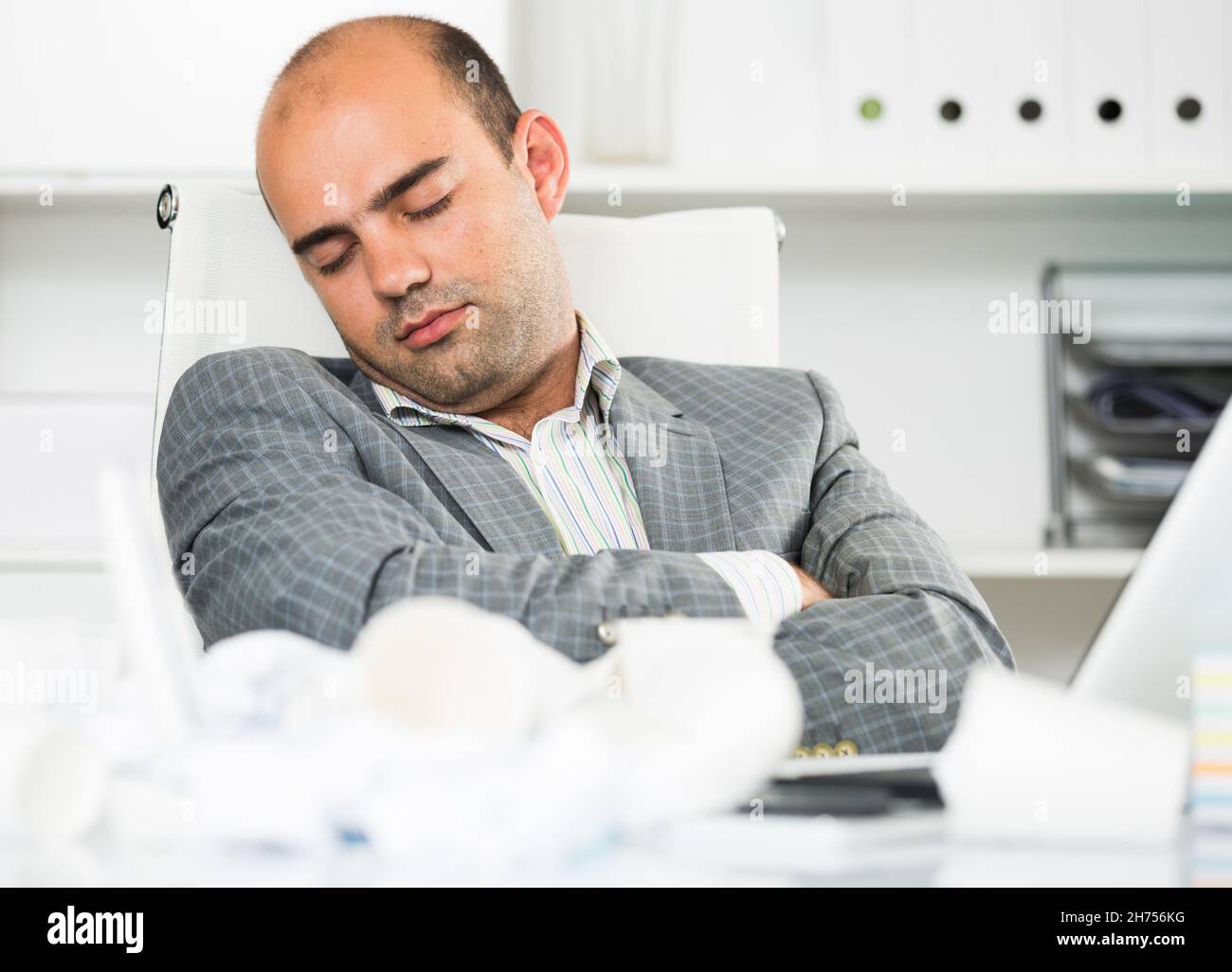 Young sad man tired of working and sleeping Stock Photo - Alamy