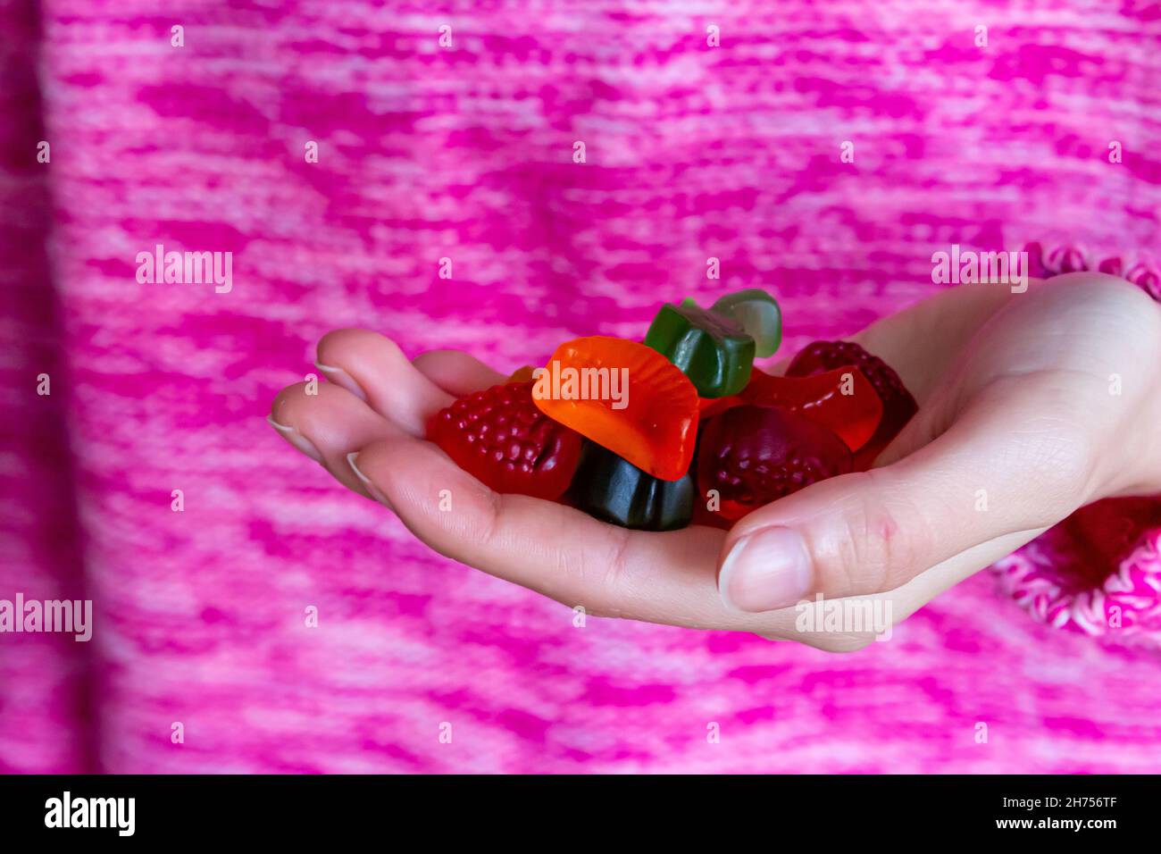 Woman holding candy, close up photo of jelly candy in girl hand Stock ...