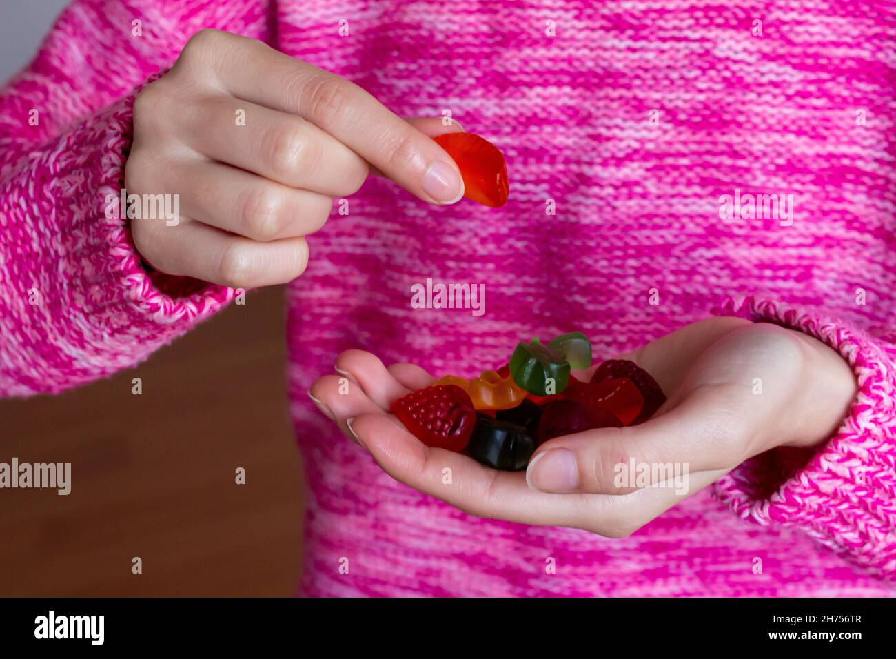 Woman holding candy, close up photo of jelly candy in girl hand Stock ...