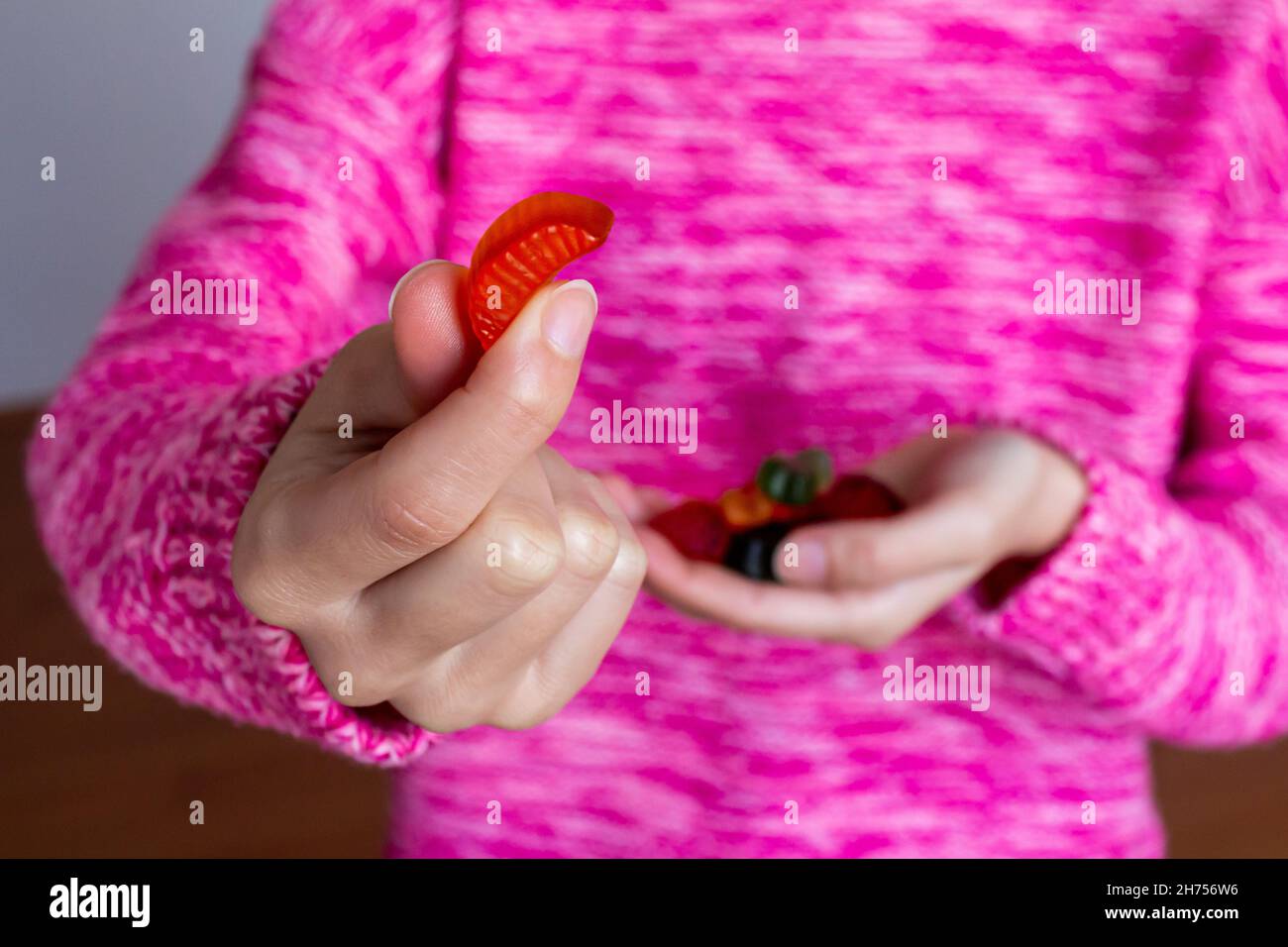 Woman holding candy, close up photo of jelly candy in girl hand Stock ...