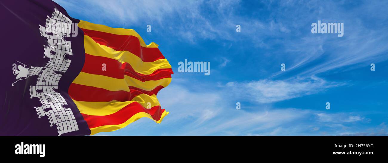 flag of Mallorca , Spain at cloudy sky background on sunset, panoramic ...