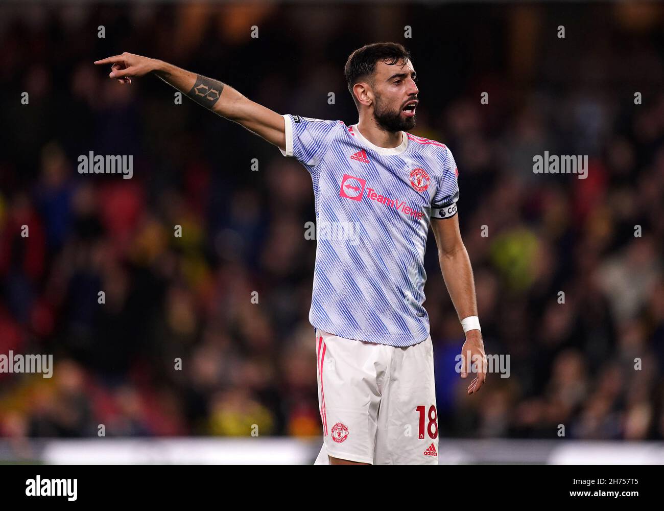Manchester United's Bruno Fernandes gestures to the away fans after the ...