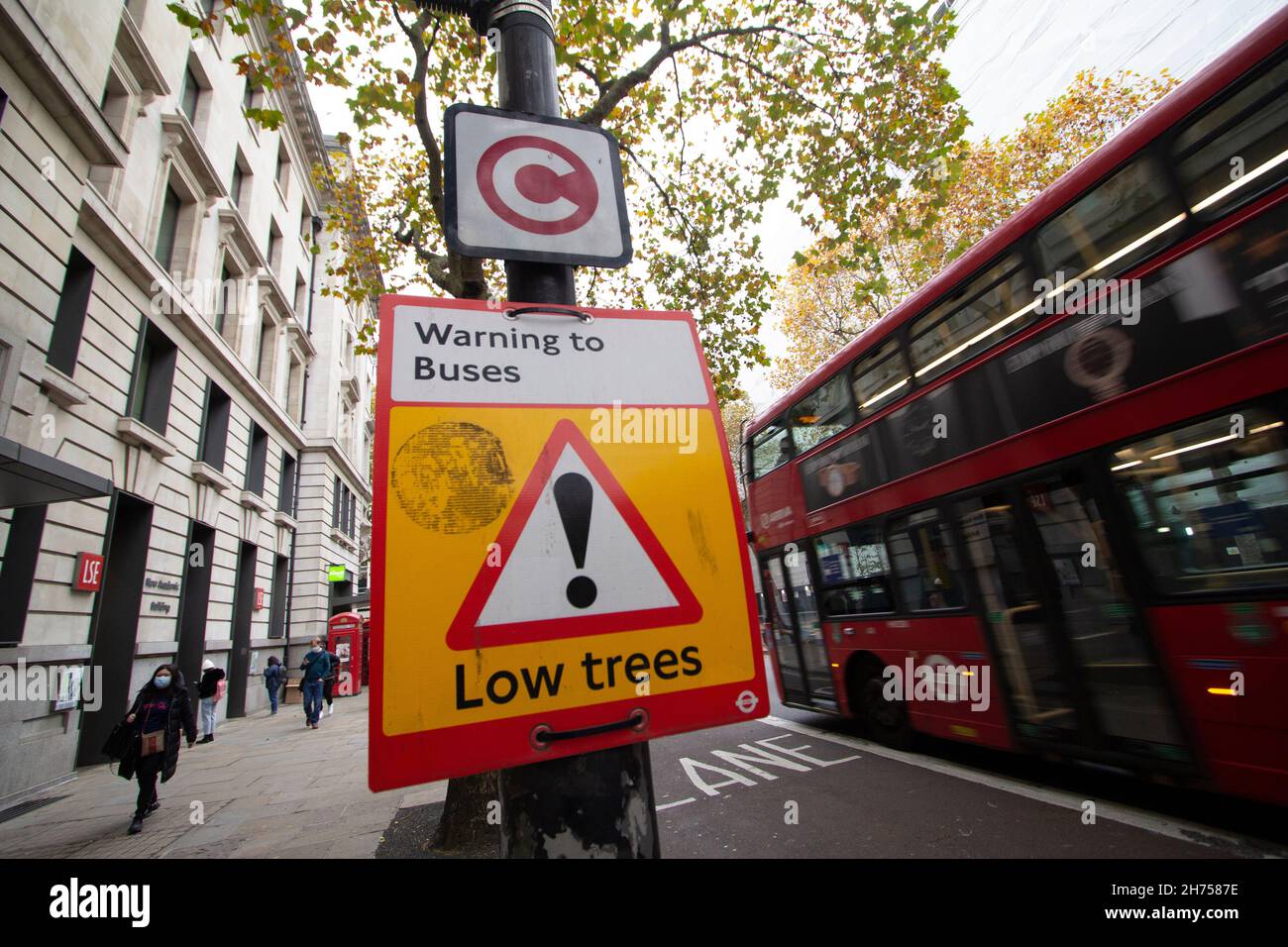 Warning to buses low trees signage in Holborn Central London Stock ...