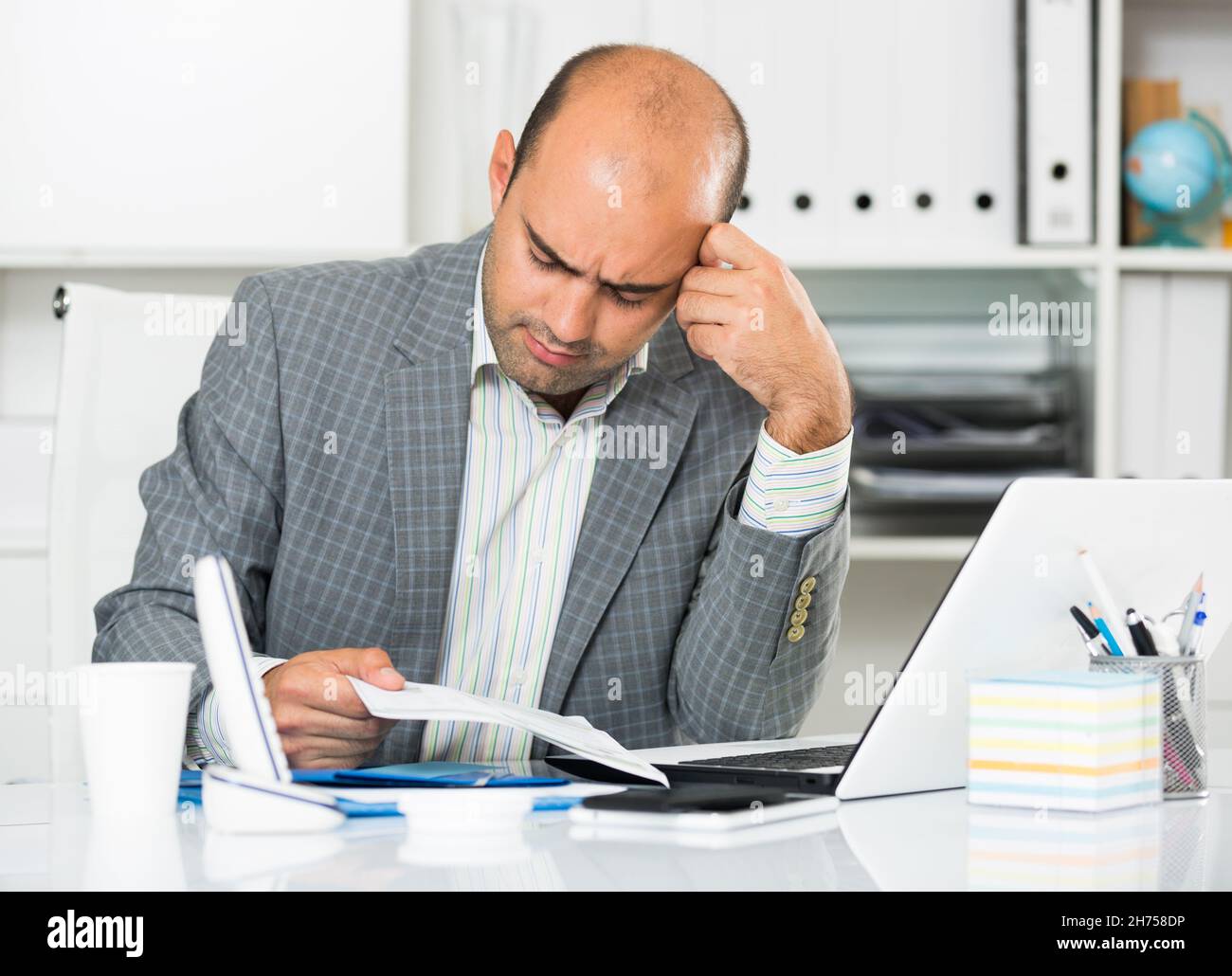 Sad businessman thinking about work Stock Photo - Alamy