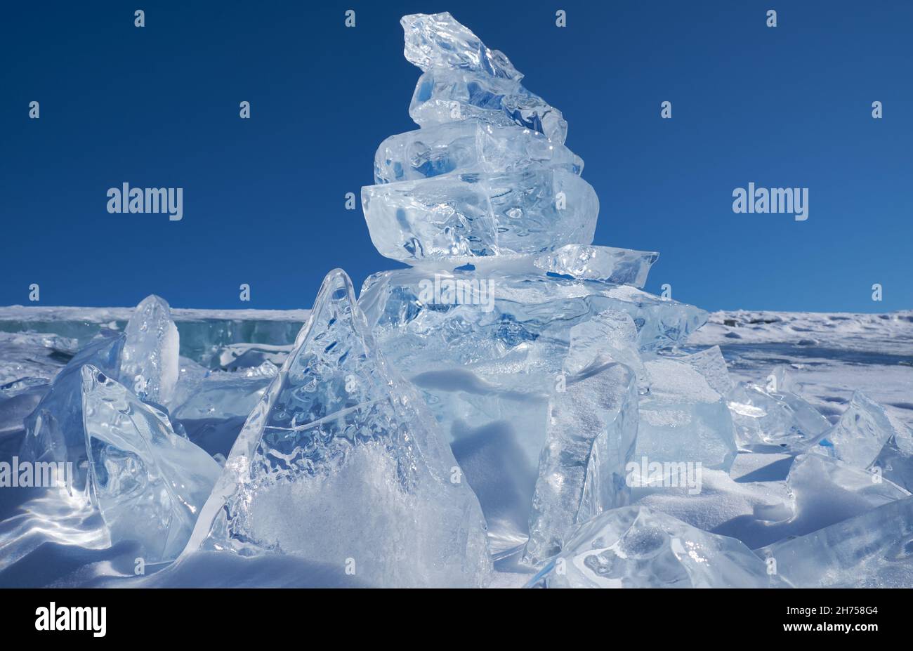 Ice floe crystal under blue sky background Stock Photo - Alamy