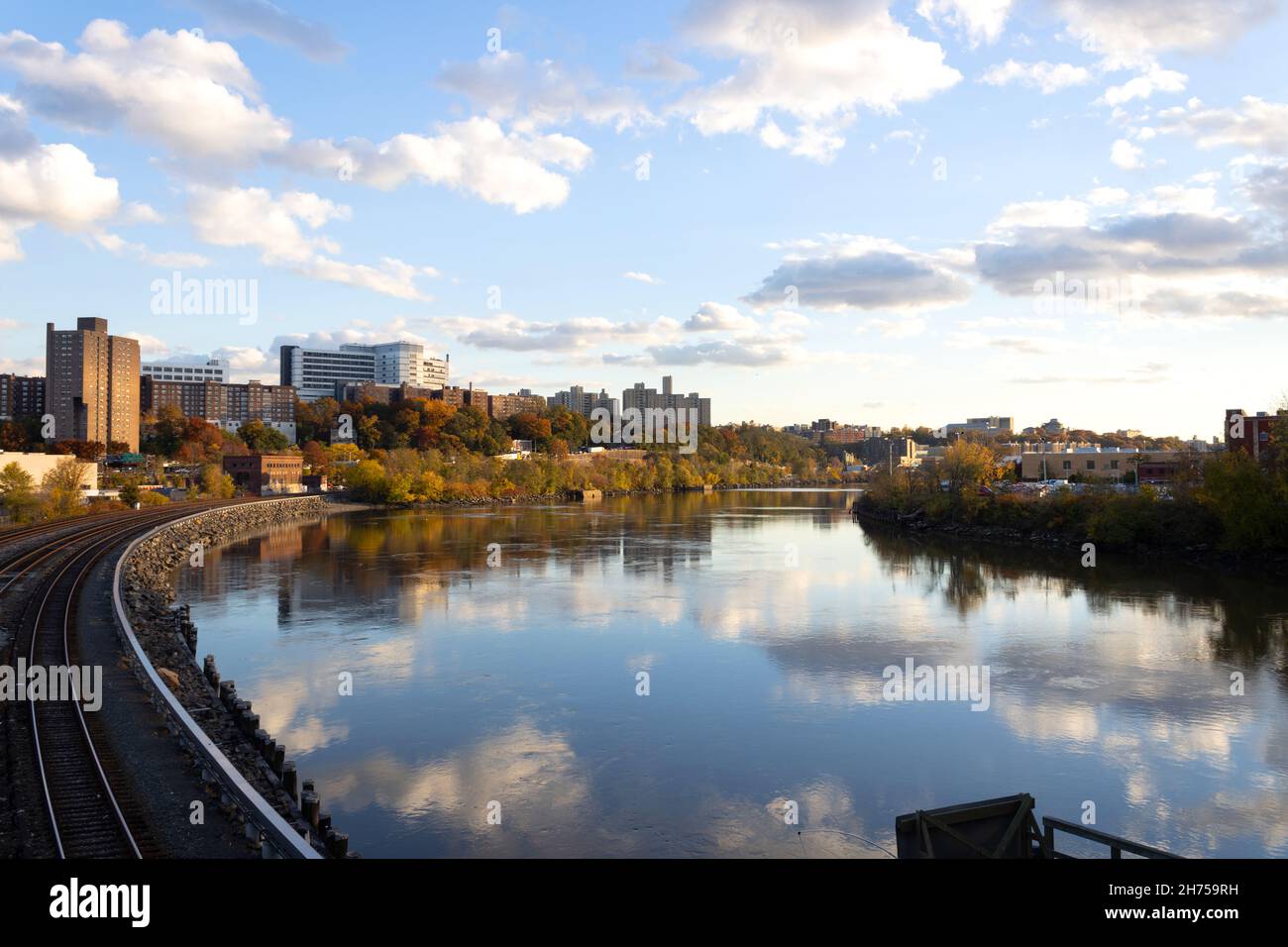 wide angle urban landscape view of the Harlem River as it curves around ...