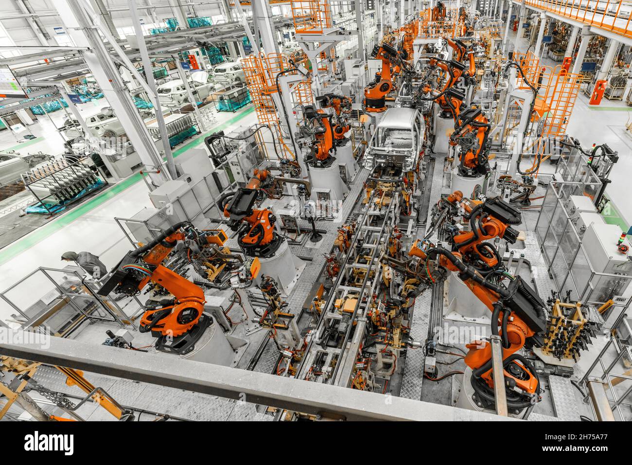 Photo of automobile production line. Welding car body. Modern car ...