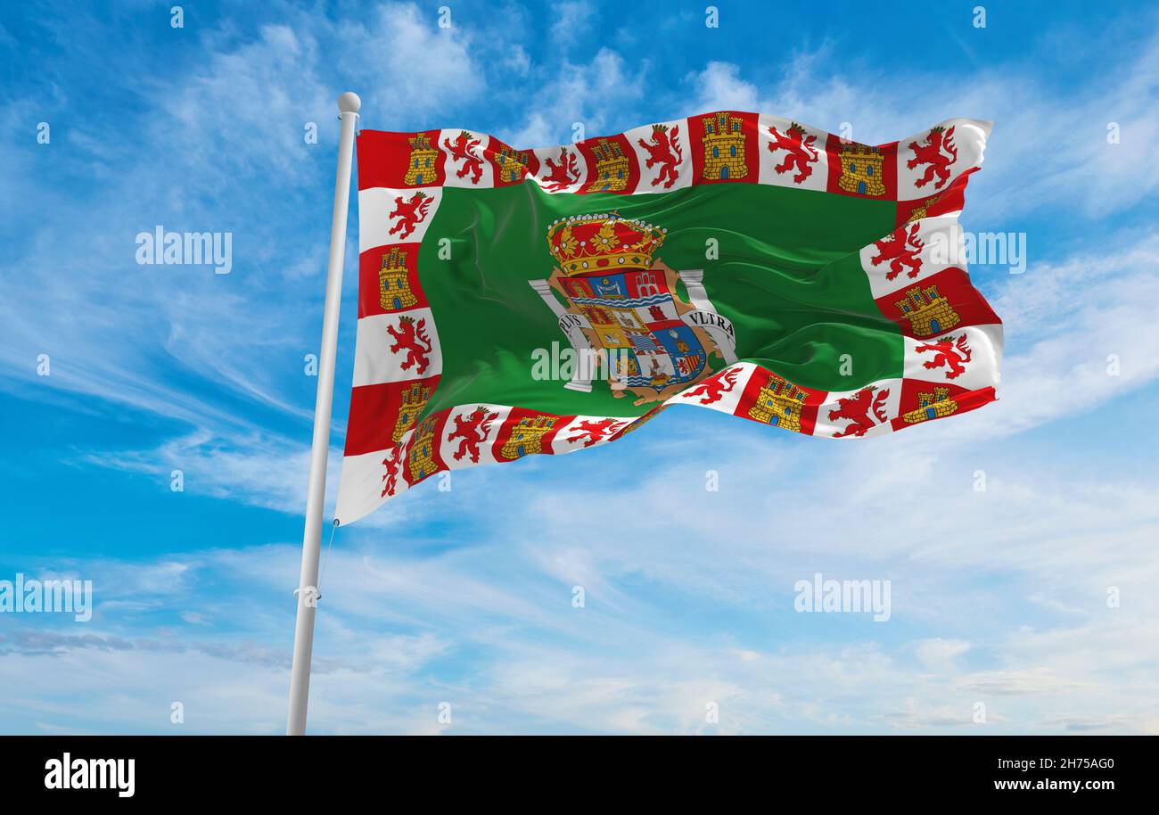 flag of Cadiz Province , Spain at cloudy sky background on sunset ...