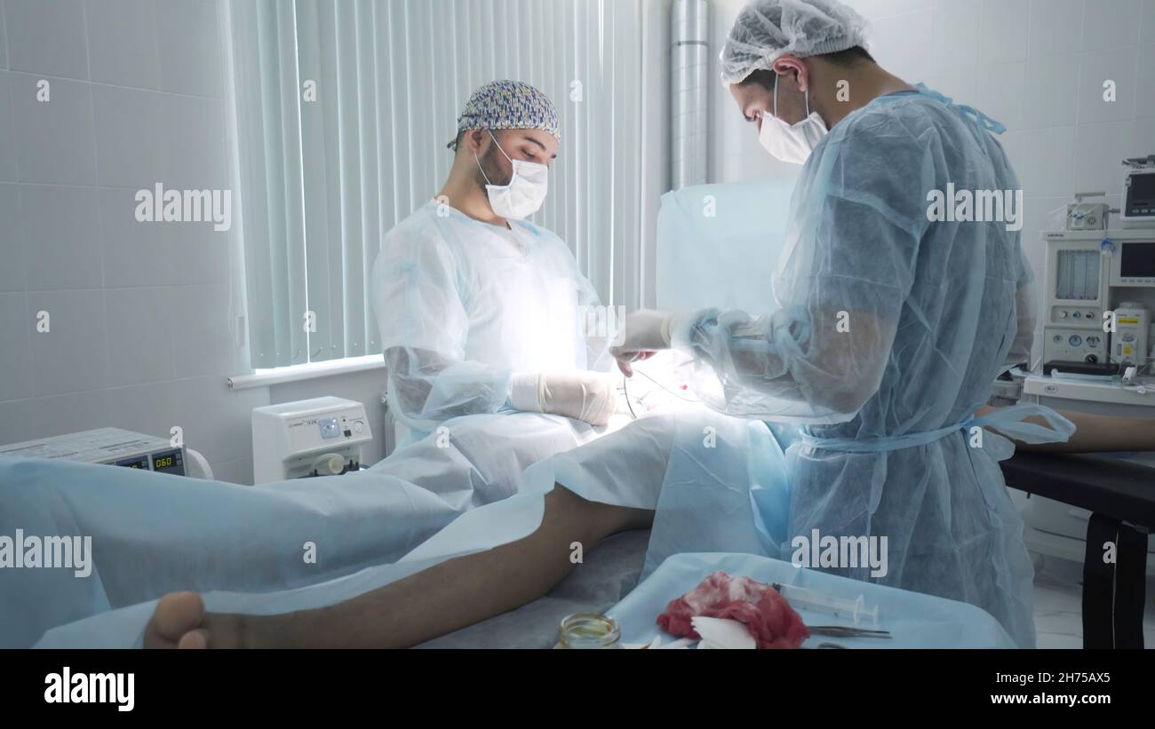 Surgeons perform light abdominal surgery. Action. Professional surgeons ...