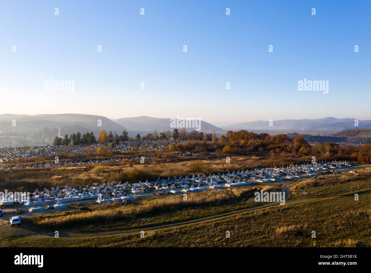 Aerial drone view of cemetery and graves in Dej city, Romania ...