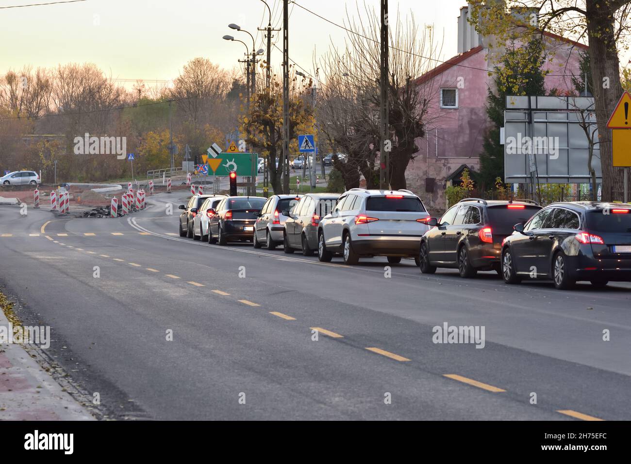 Traffic jam and high beam swinging lights when crossing a road work ...