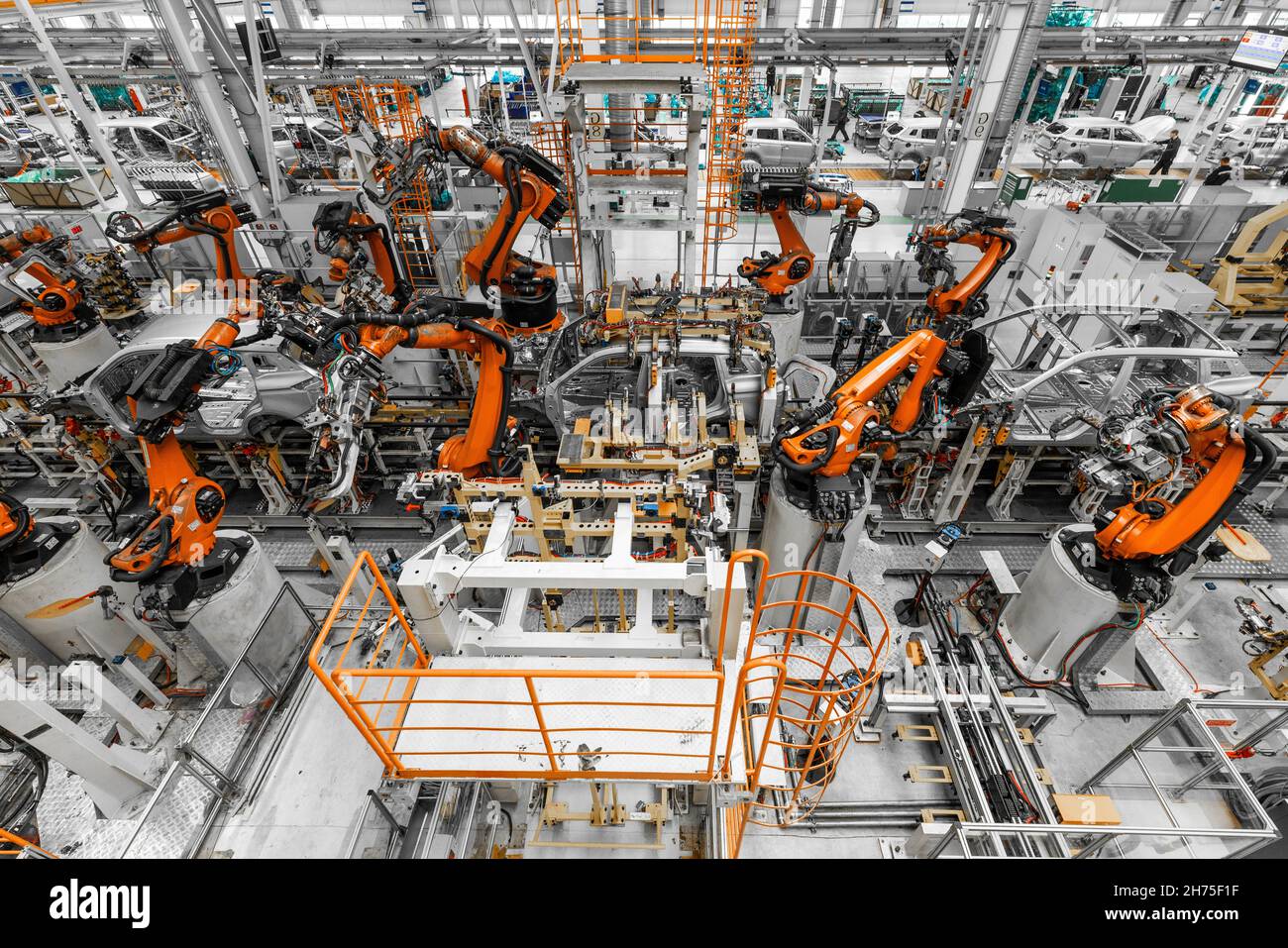 Photo of automobile production line. Welding car body. Modern car ...