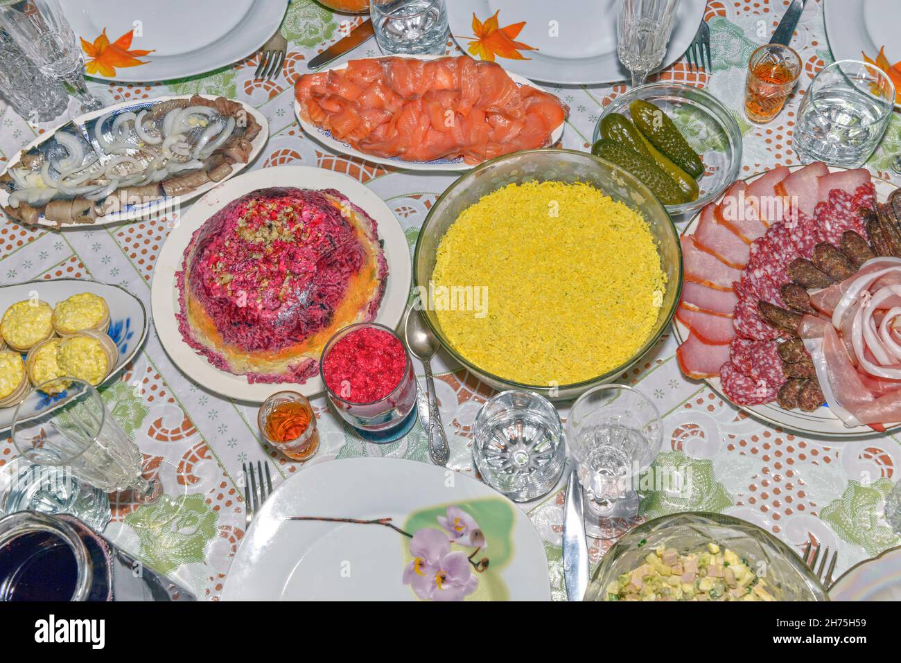 Festive table setting with cold starters in modern simple Ukrainian ...