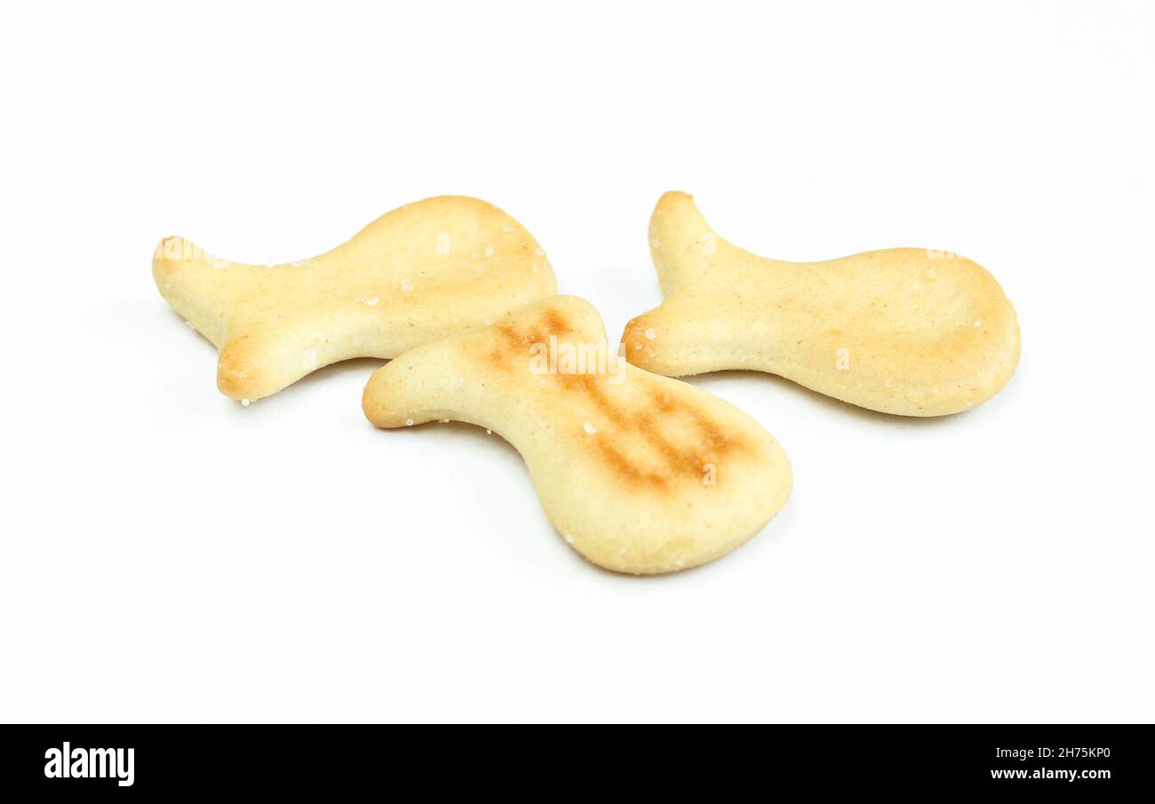 Few salty crackers isolated on white background. Fish shaped snack ...